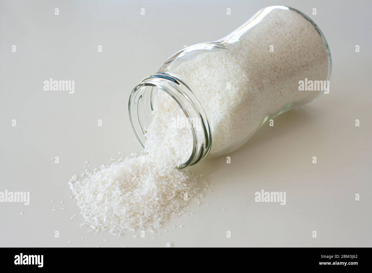Shredded coconut in a ready-to-use jar Stock Photo - Alamy