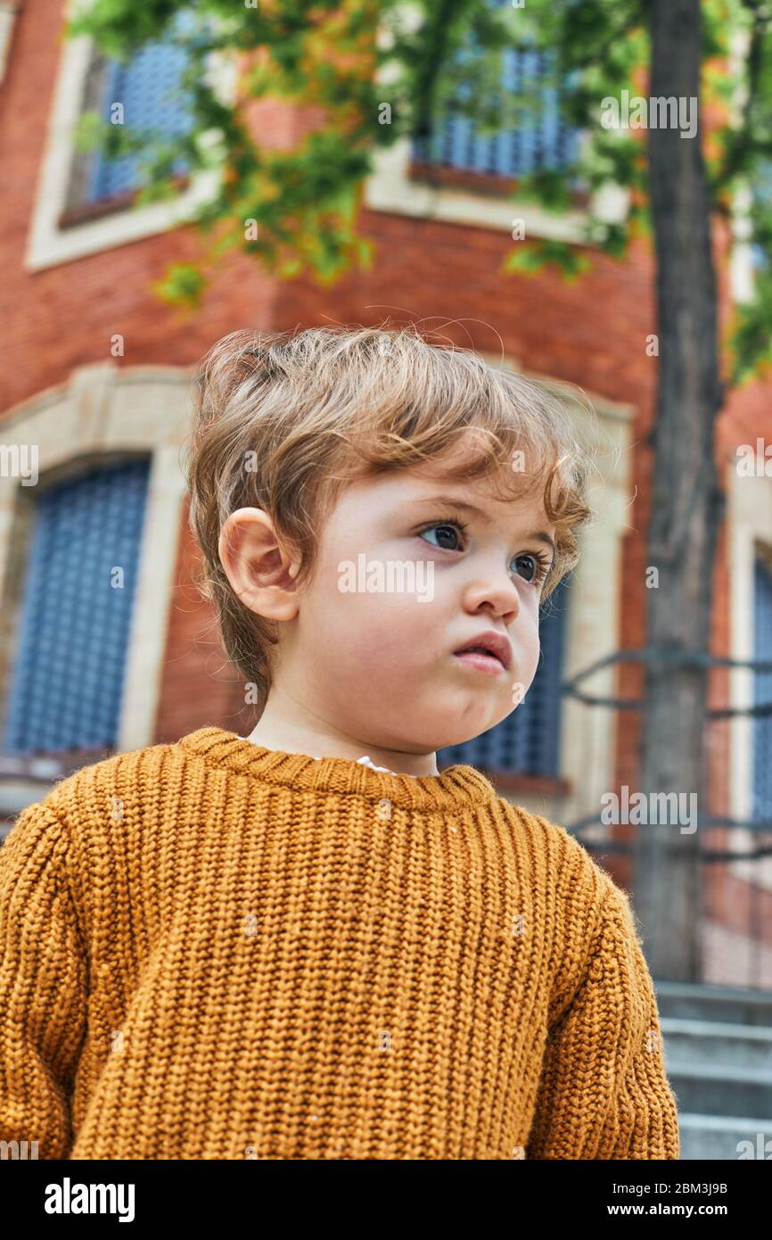 Portrait of a happy boy observing his surroundings Stock Photo - Alamy
