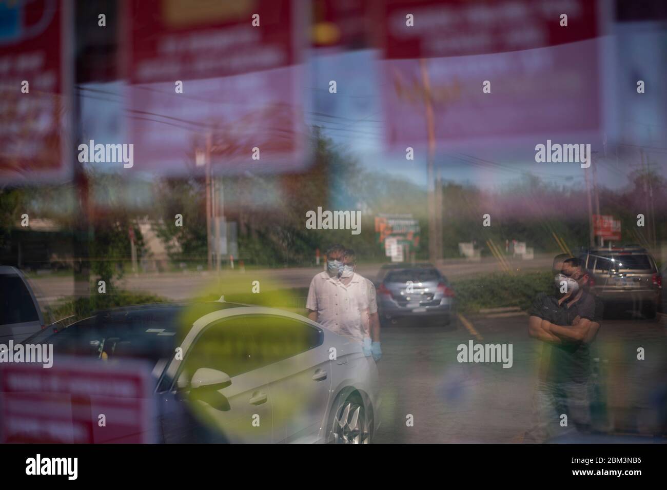 Manhattan, Kansas, USA. 5th May, 2020. Customers of Asian Market wait ...