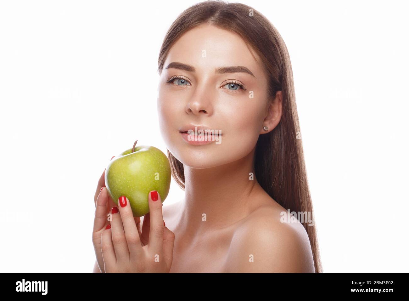 Beautiful young girl with a light natural make-up and perfect skin with ...