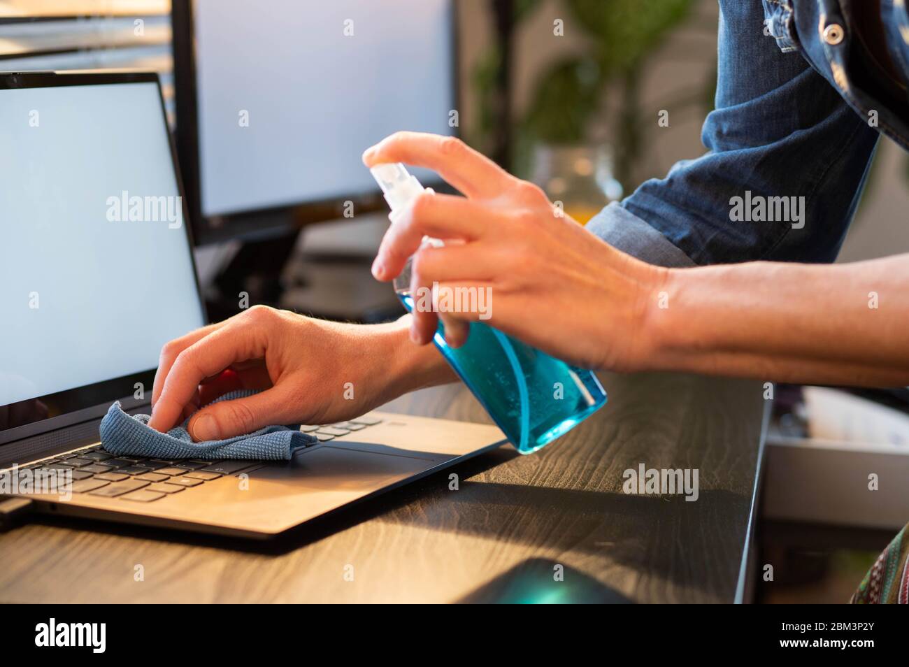 sanitizing computer or laptop keyboard coronavirus protection Stock ...
