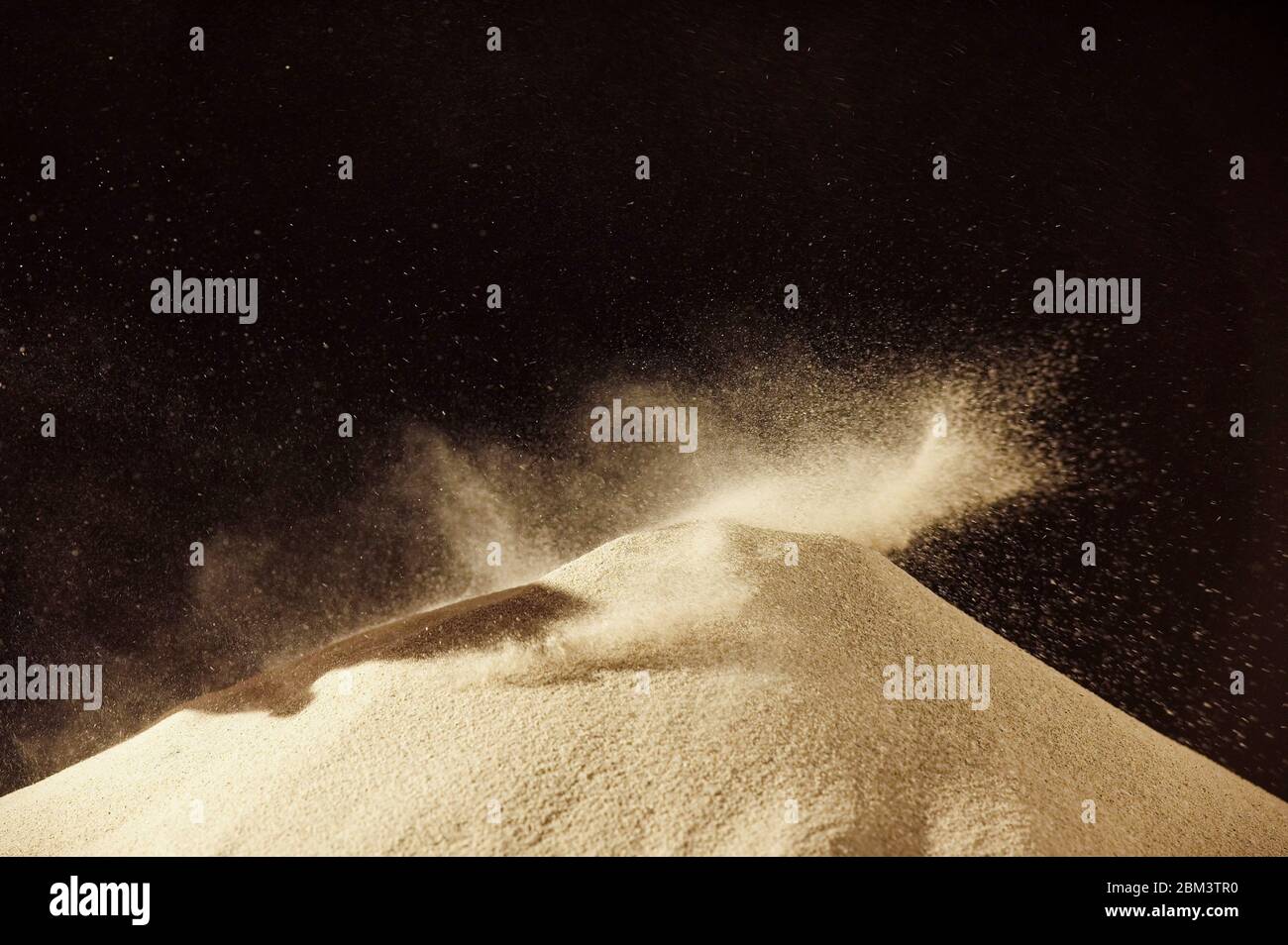 Freeze motion of dust particles on black background. Powder explosion ...