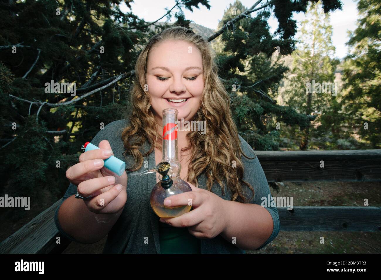 Woman smokes pot hi-res stock photography and images - Alamy