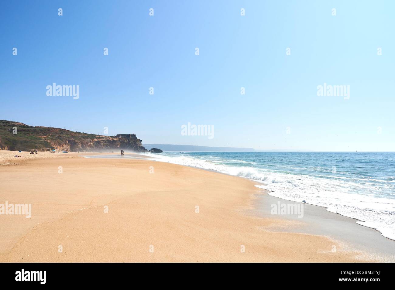 View over the beach of Norte with the clif and the fortress at the end ...