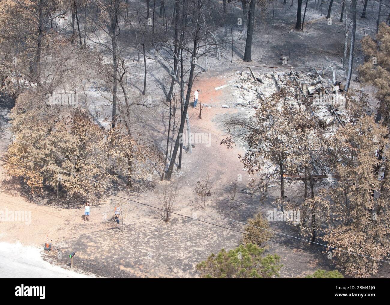 Bastrop Texas USA, September 16 2011: Resident returns to damaged home ...