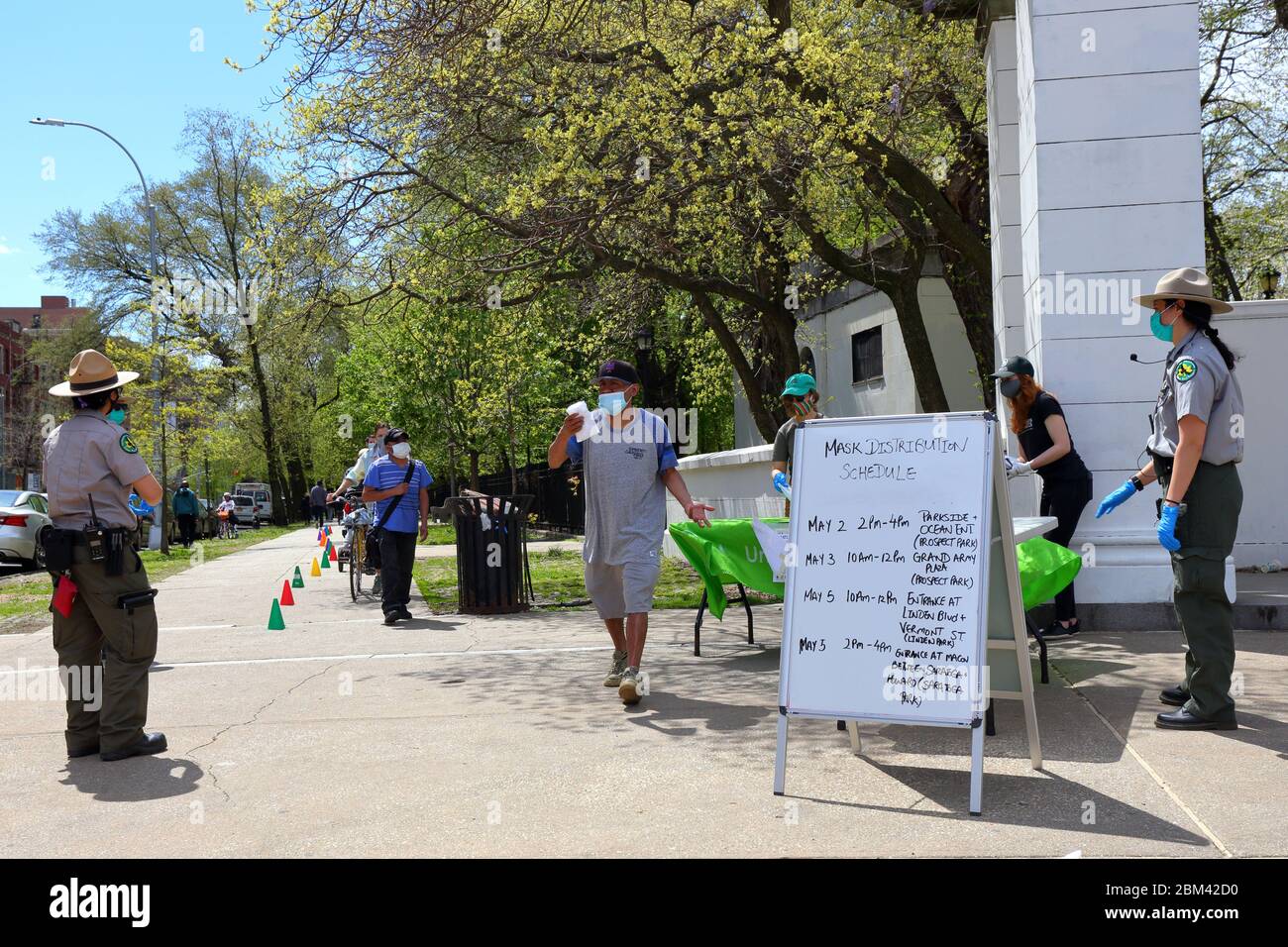 NYC Parks Department personnel distribute free cloth face masks to ...