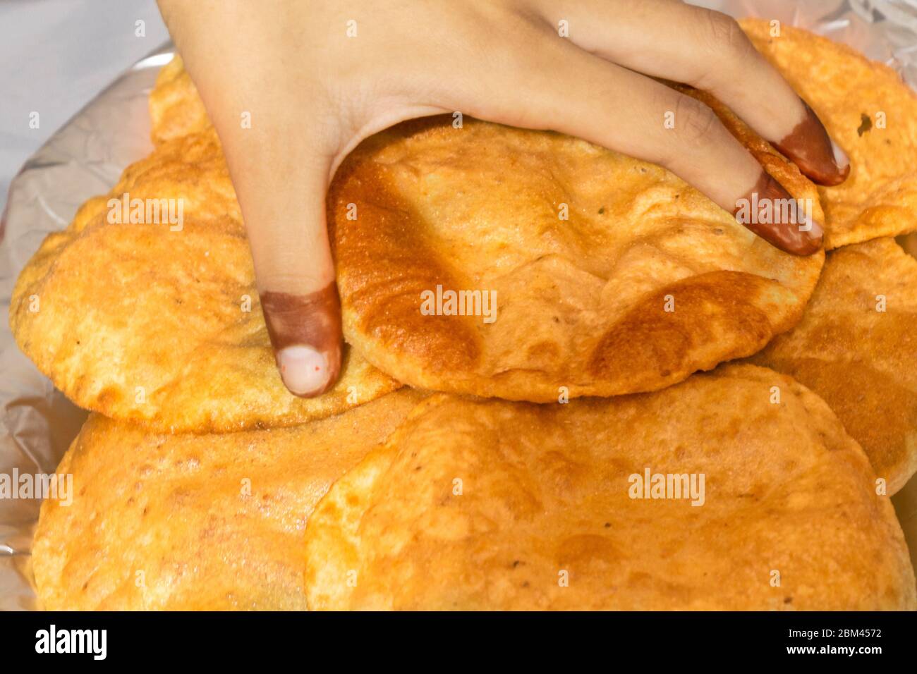 Indian Cuisine Puri close up, delicious deep fried poori (puri) served ...