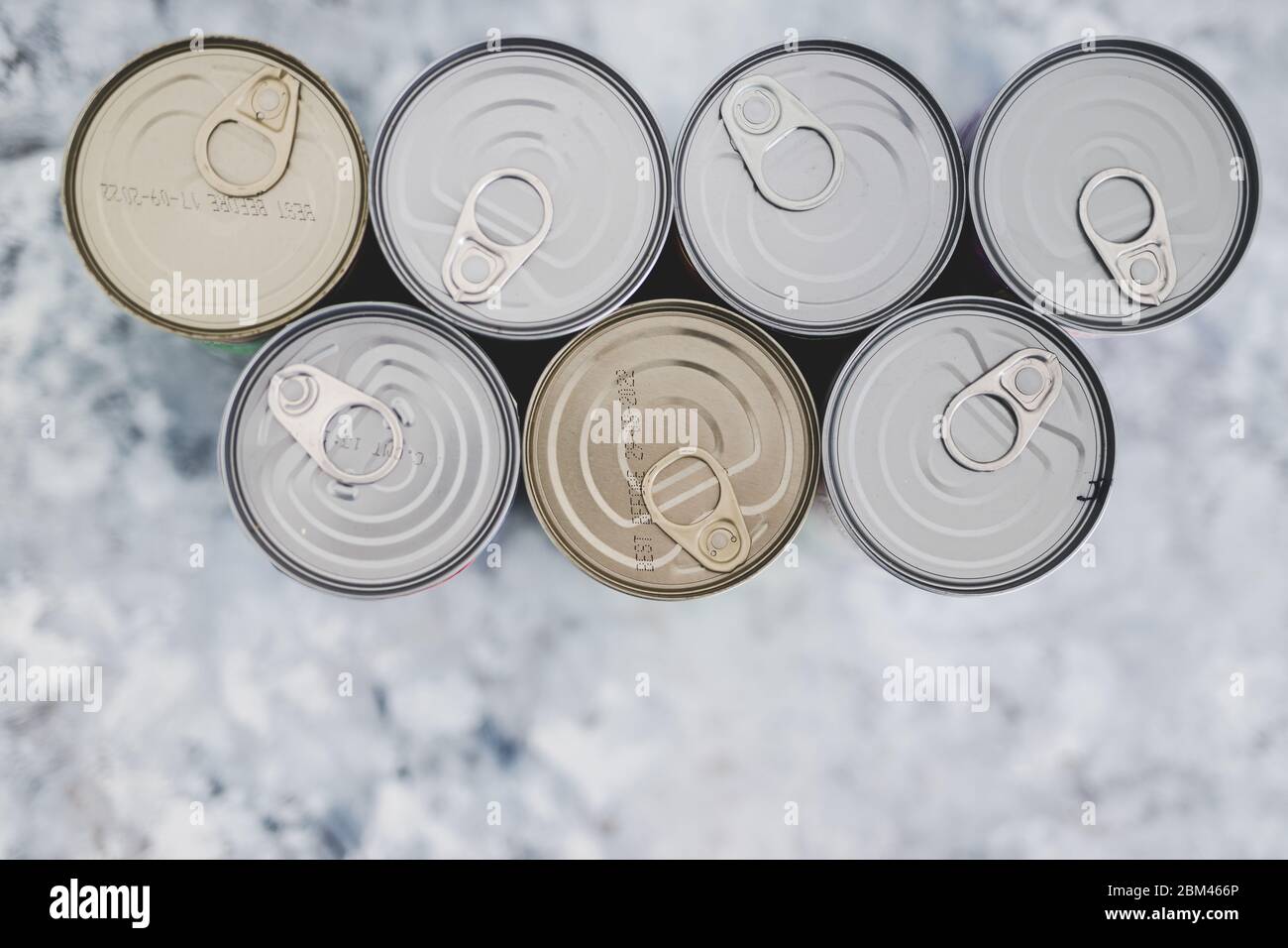 non-perishable pantry food, group of bean cans shot from top down ...