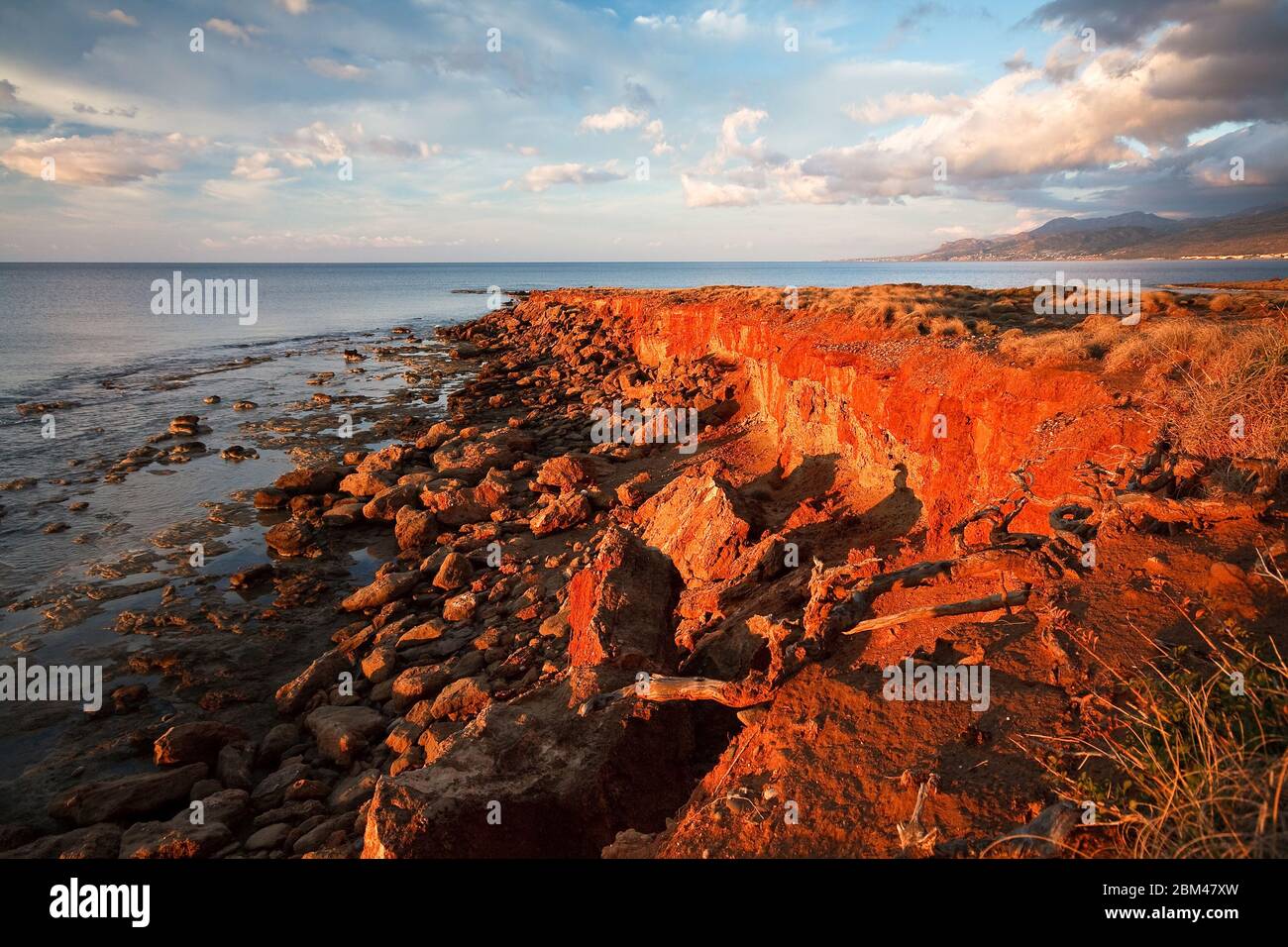 Sunset on the coast of Crete, Greece Stock Photo - Alamy