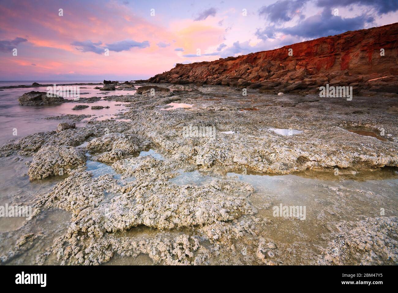 Sunset on a beach in Crete, Greece Stock Photo - Alamy