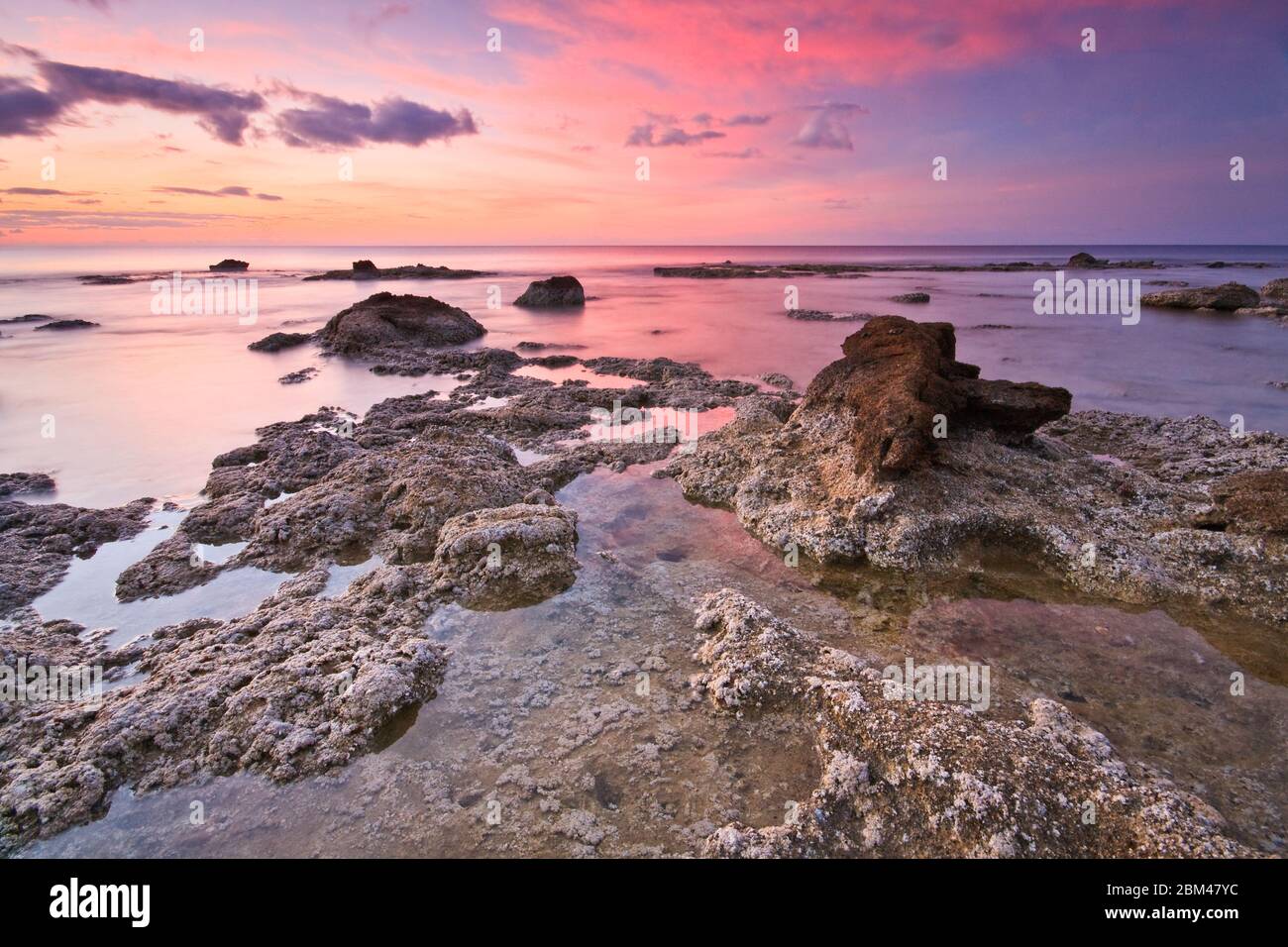 Sunset on a beach in Crete, Greece Stock Photo - Alamy