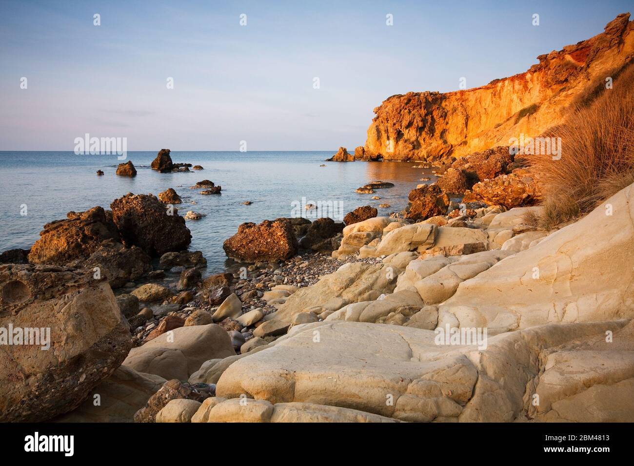 Sunset light on a cliff in Crete, Greece Stock Photo - Alamy