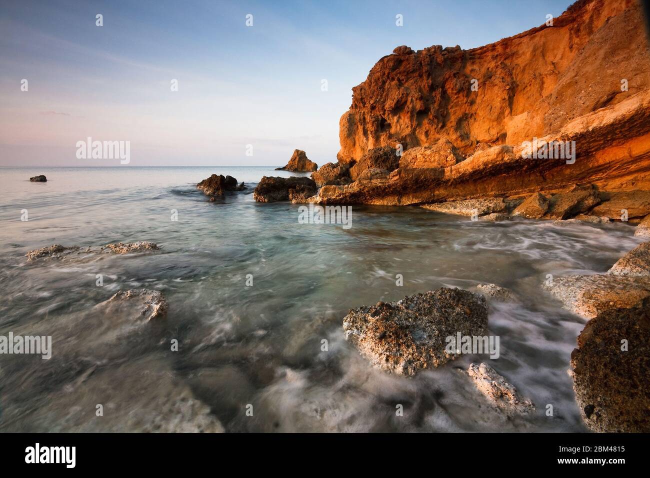 Sunset light on a cliff in Crete, Greece Stock Photo - Alamy