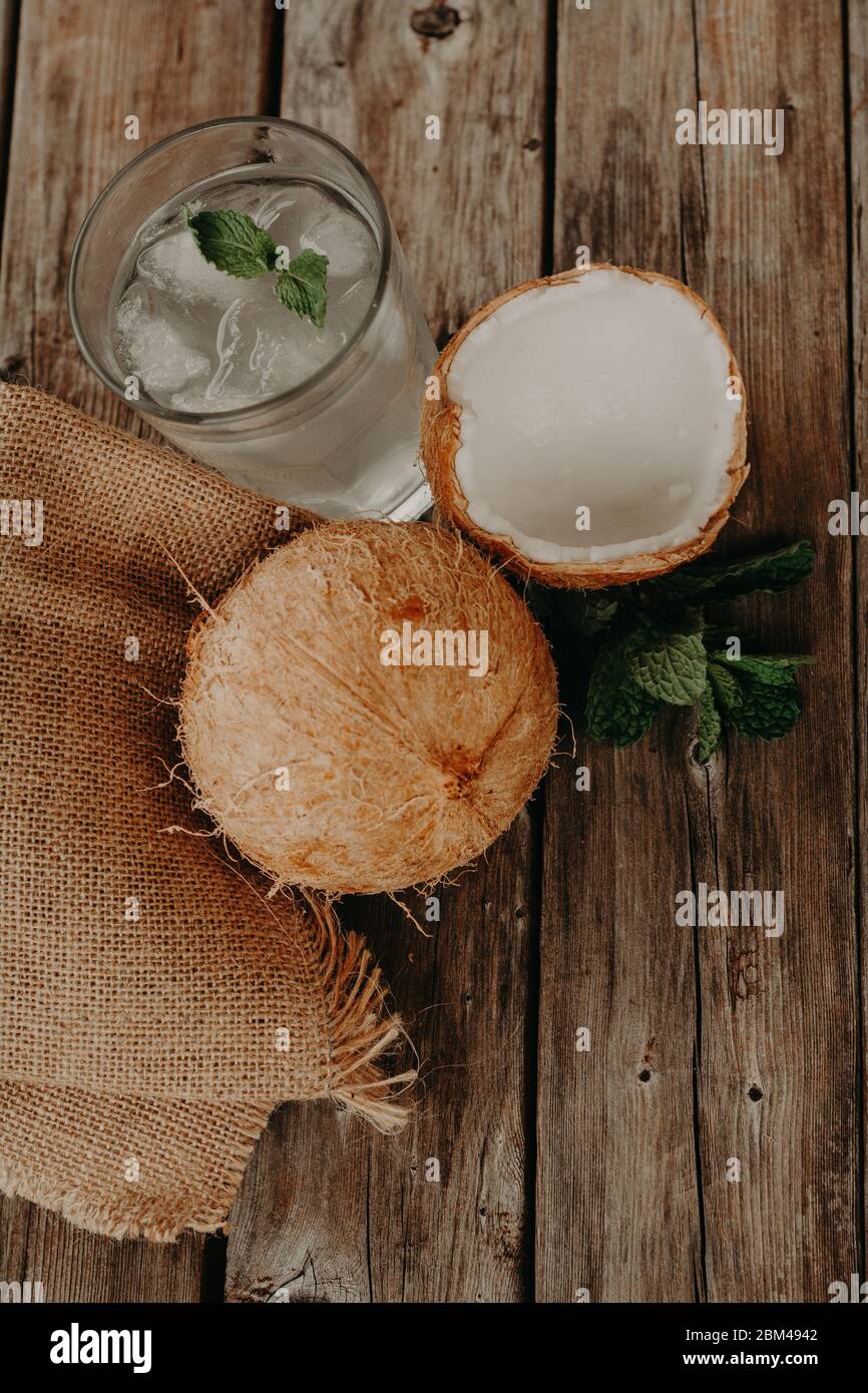 Coconut water. Fresh and delicious coconut water. wood and green ...