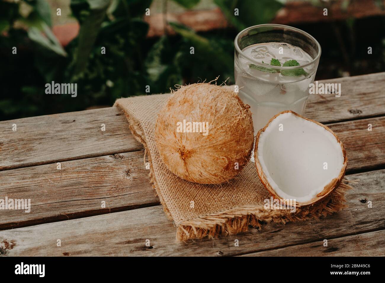 Coconut water. Fresh and delicious coconut water. wood and green ...