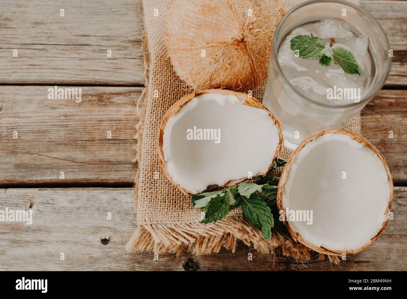 Coconut water. Fresh and delicious coconut water. wood and green ...