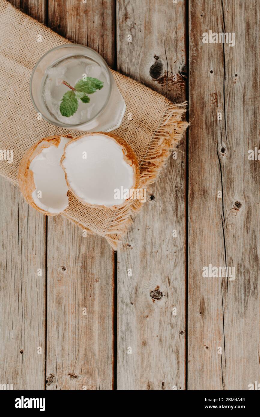 Coconut water. Fresh and delicious coconut water. wood and green ...