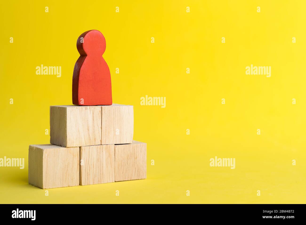 Red wood figure Stand on wood stack in human resource management or ...