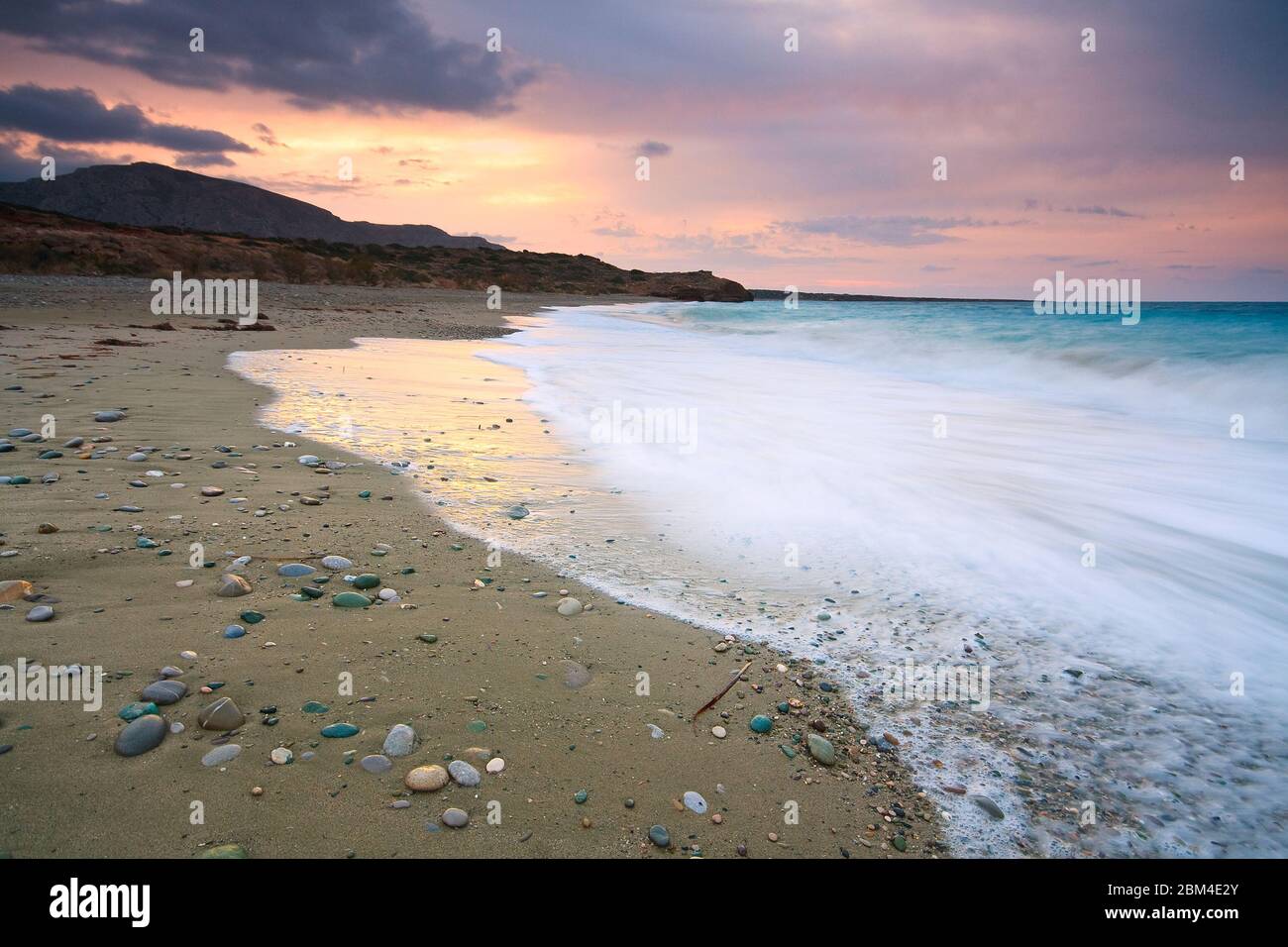 Cloudy sunset on a beach in Crete, Greece Stock Photo - Alamy