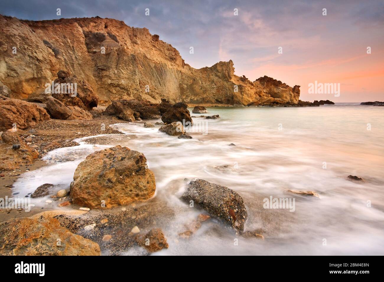Sunset on a beach in Crete, Greece Stock Photo - Alamy