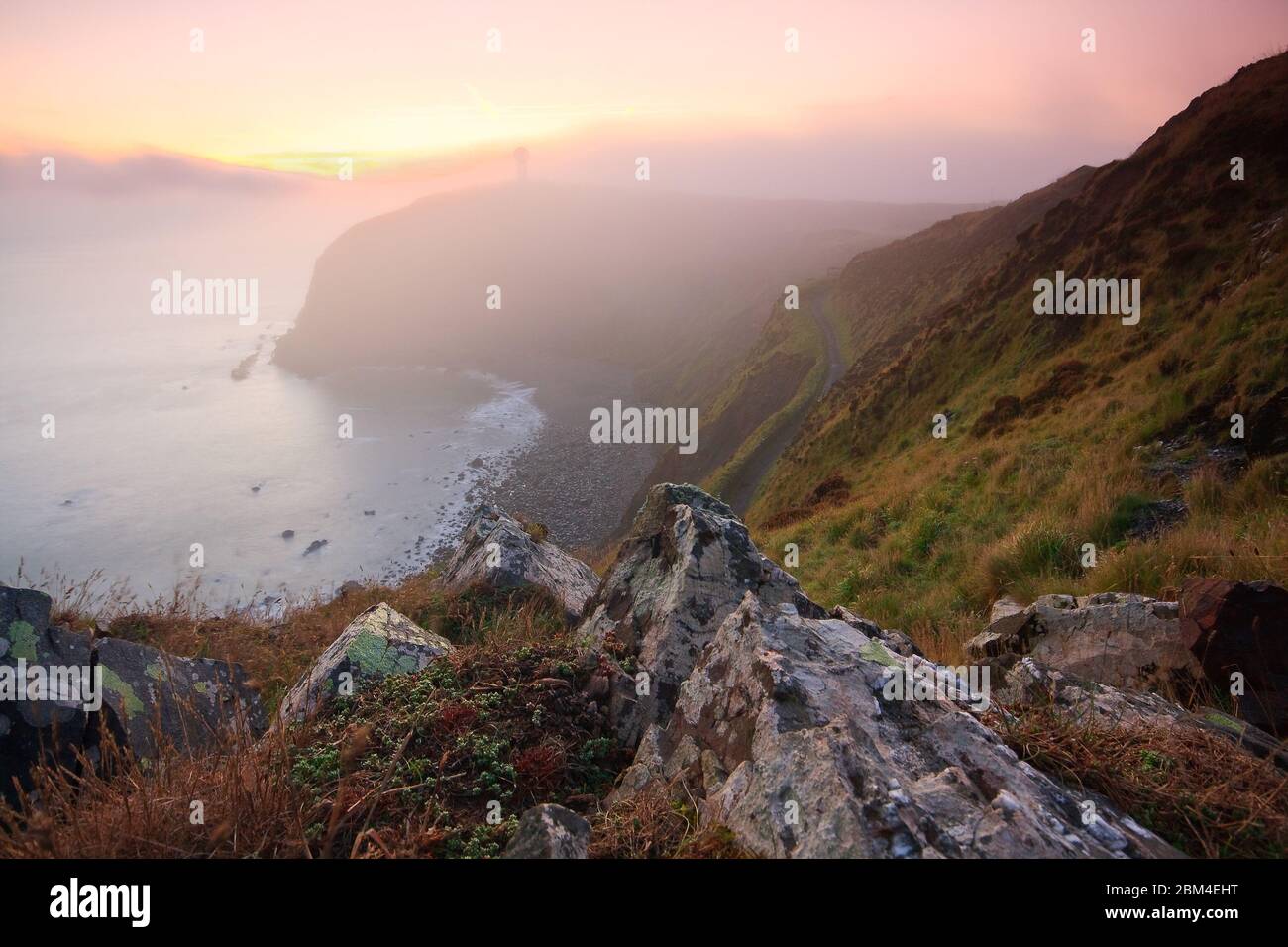 Morning fog rolling over the radar station in Barley Bay, Devon, UK ...