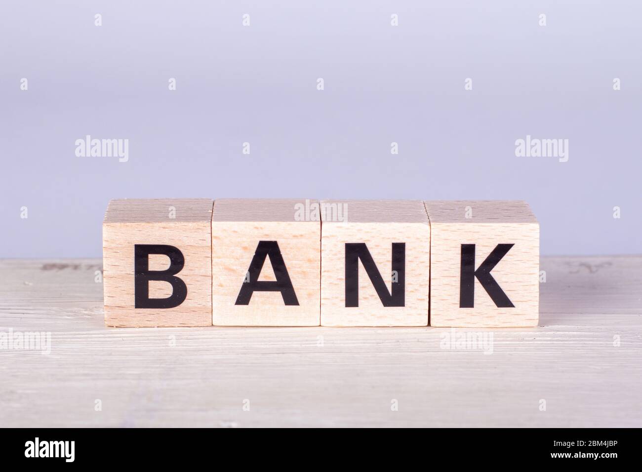 wooden cubes building the word Bank, white background and board Stock ...