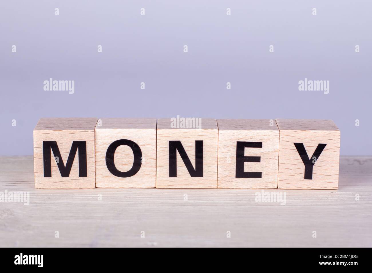 wooden cubes building the word Money, white background and board Stock ...