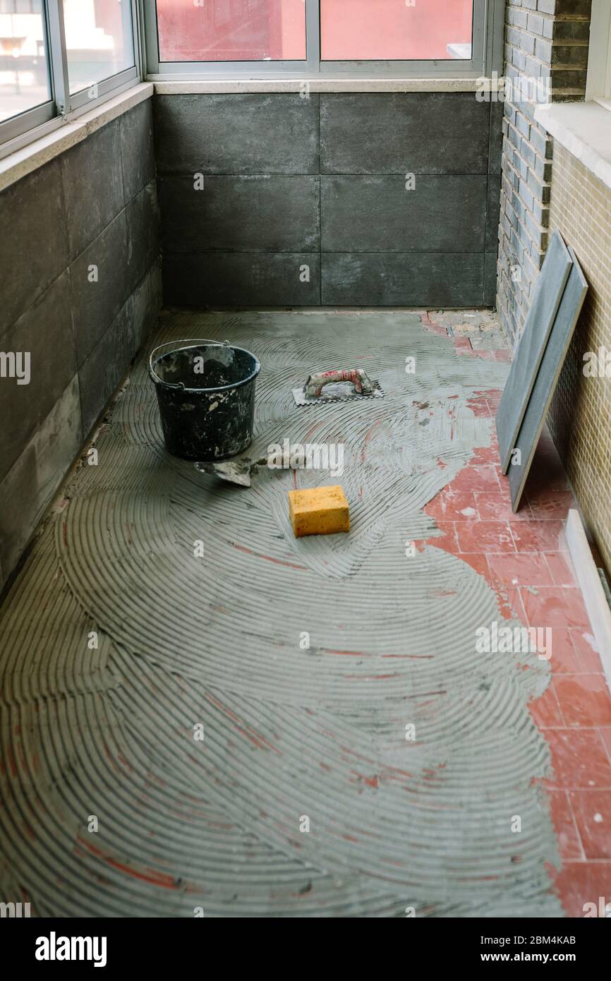 Tile laying work on floor Stock Photo - Alamy