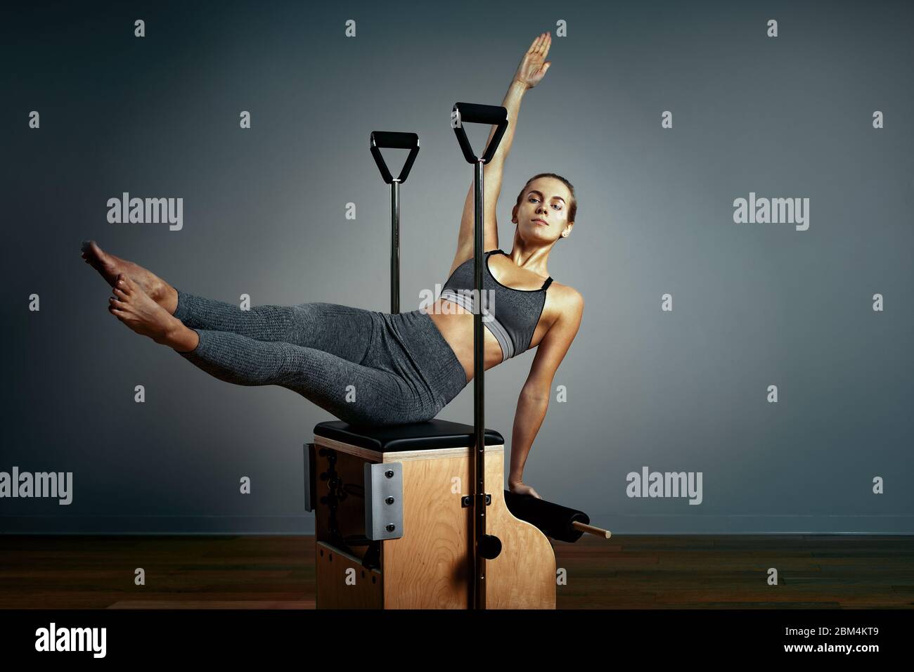 Pilates reformer chair woman fitness yoga gym exercise. Correction of ...