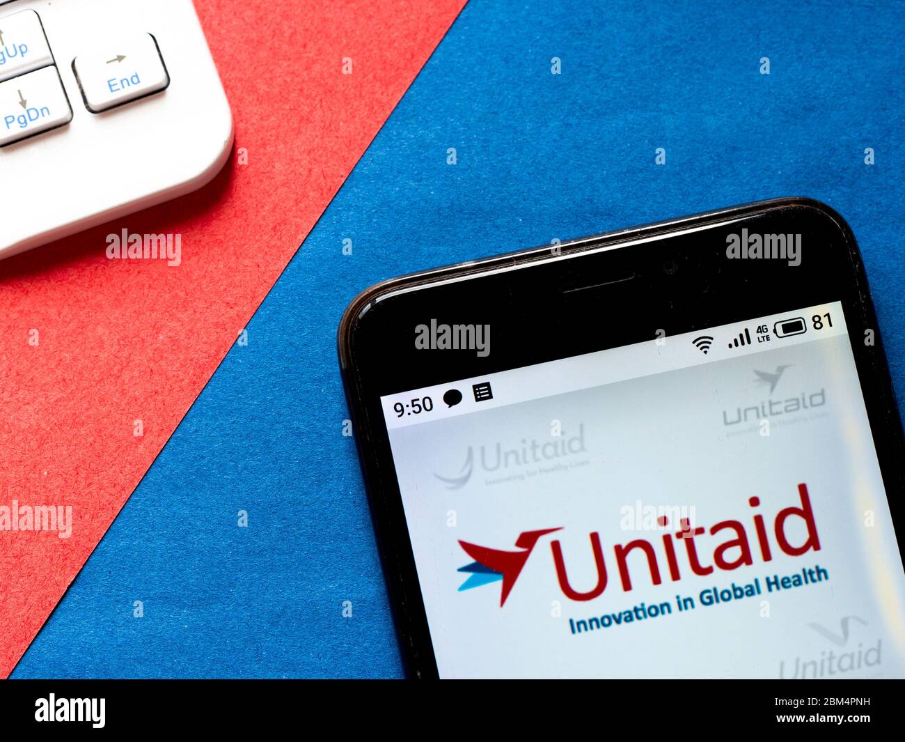 In this photo illustration an Unitaid logo is seen displayed on a smartphone Stock Photo - Alamy