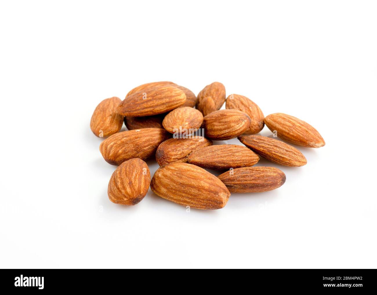 close-up almonds nuts isolated on white background Stock Photo - Alamy
