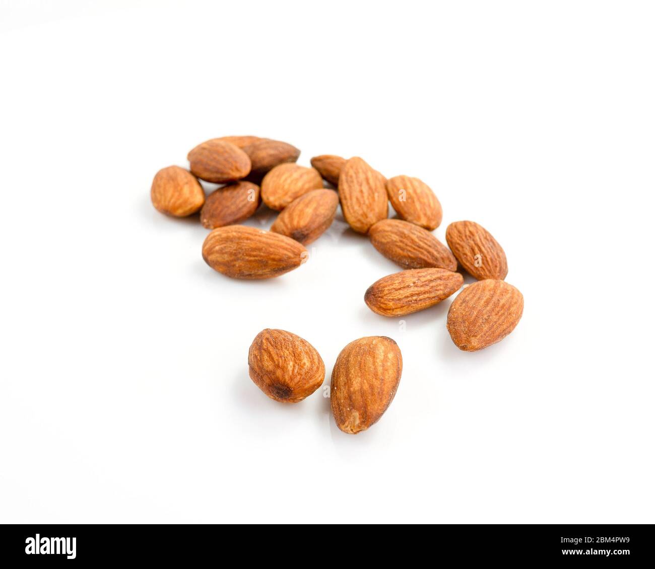 close-up almonds nuts isolated on white background Stock Photo - Alamy