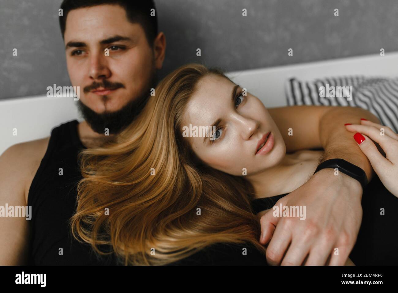 Woman lying on the chest of her man. Stay home Stock Photo - Alamy