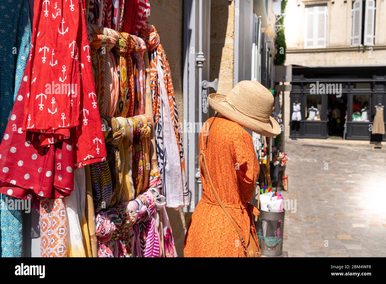 Colorful clothes on racks in street fashion boutique store Stock Photo ...