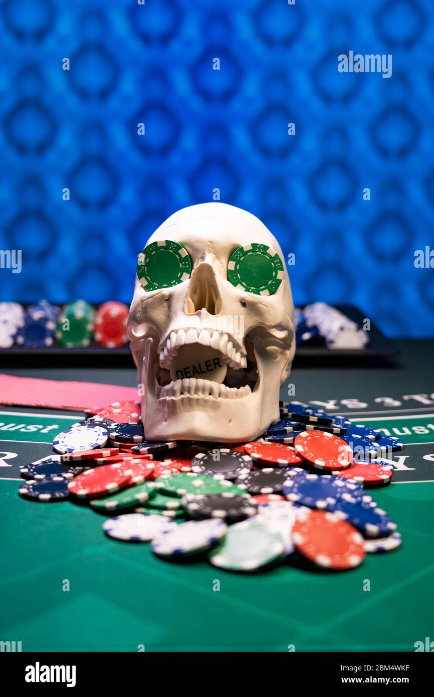 Human skull at Black Jack table Stock Photo - Alamy