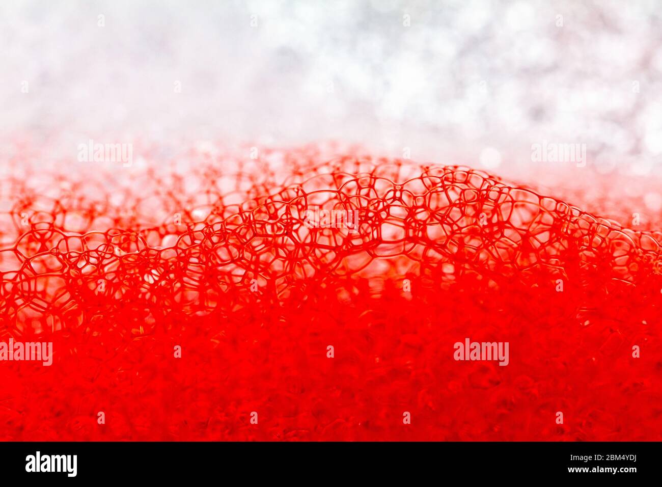 Soap foam texture with red background Stock Photo - Alamy