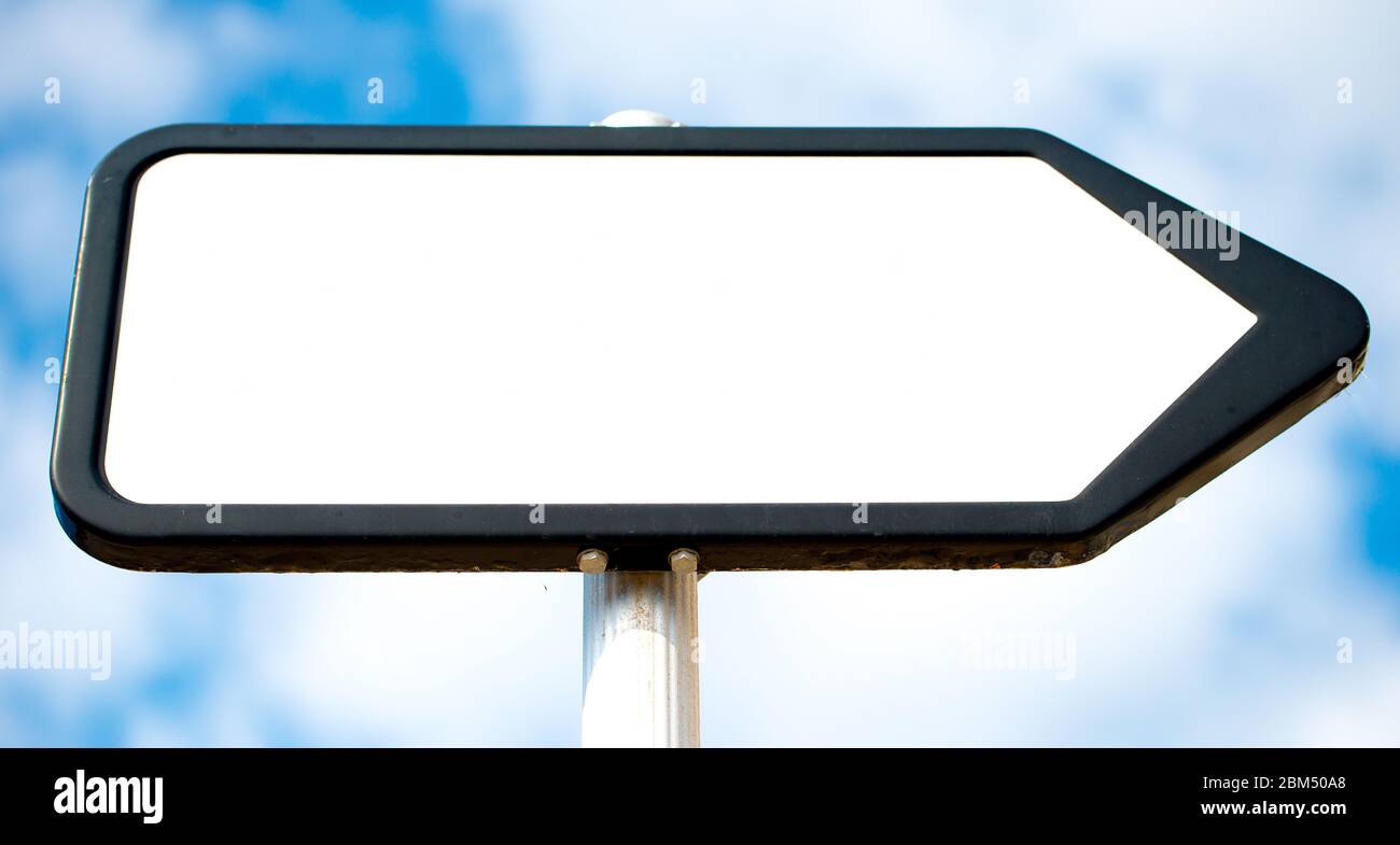 Low angle view of a plain white, blank, pointing the way, information ...