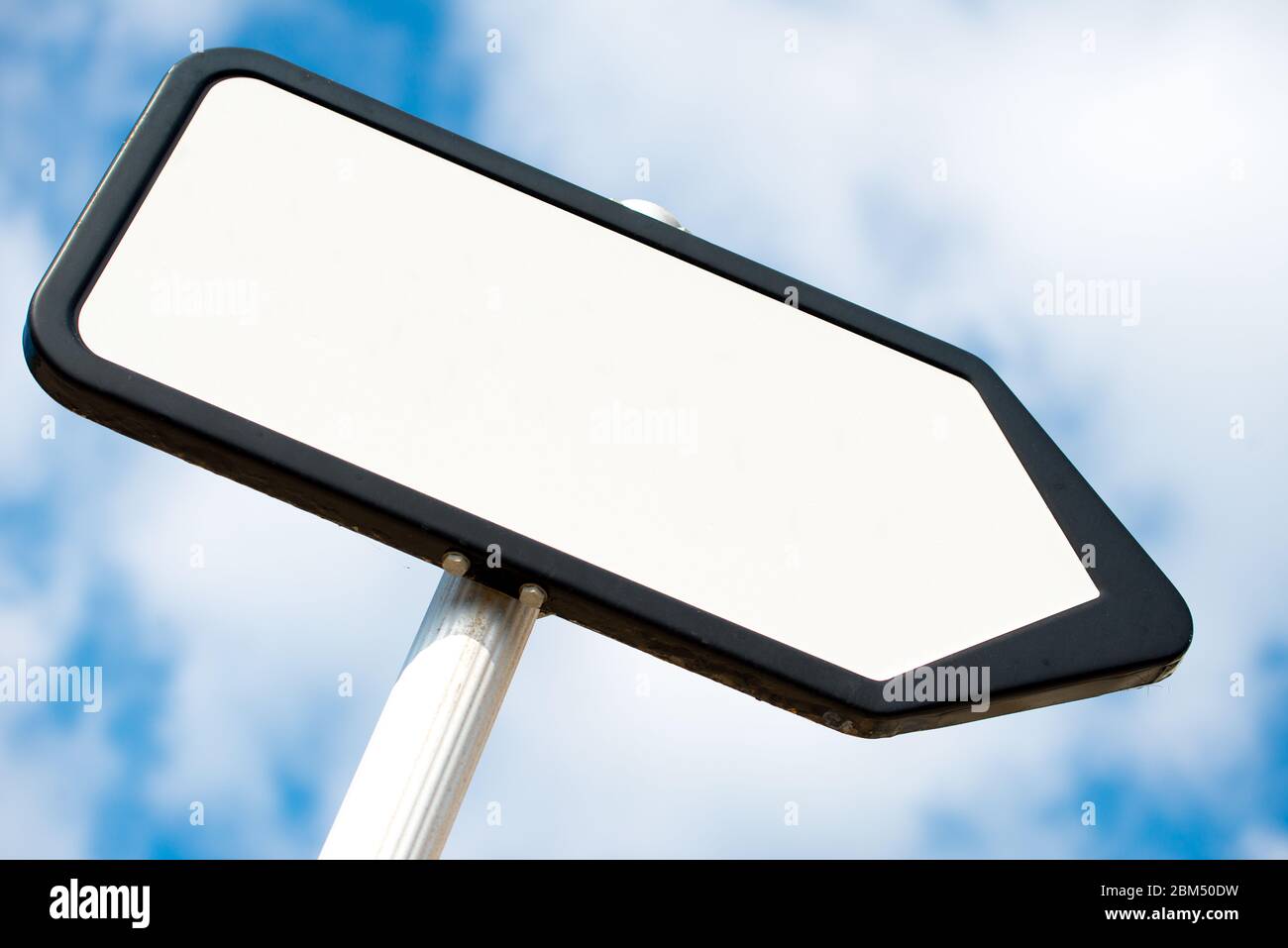 Low angle view of a plain white, blank, pointing the way, information ...