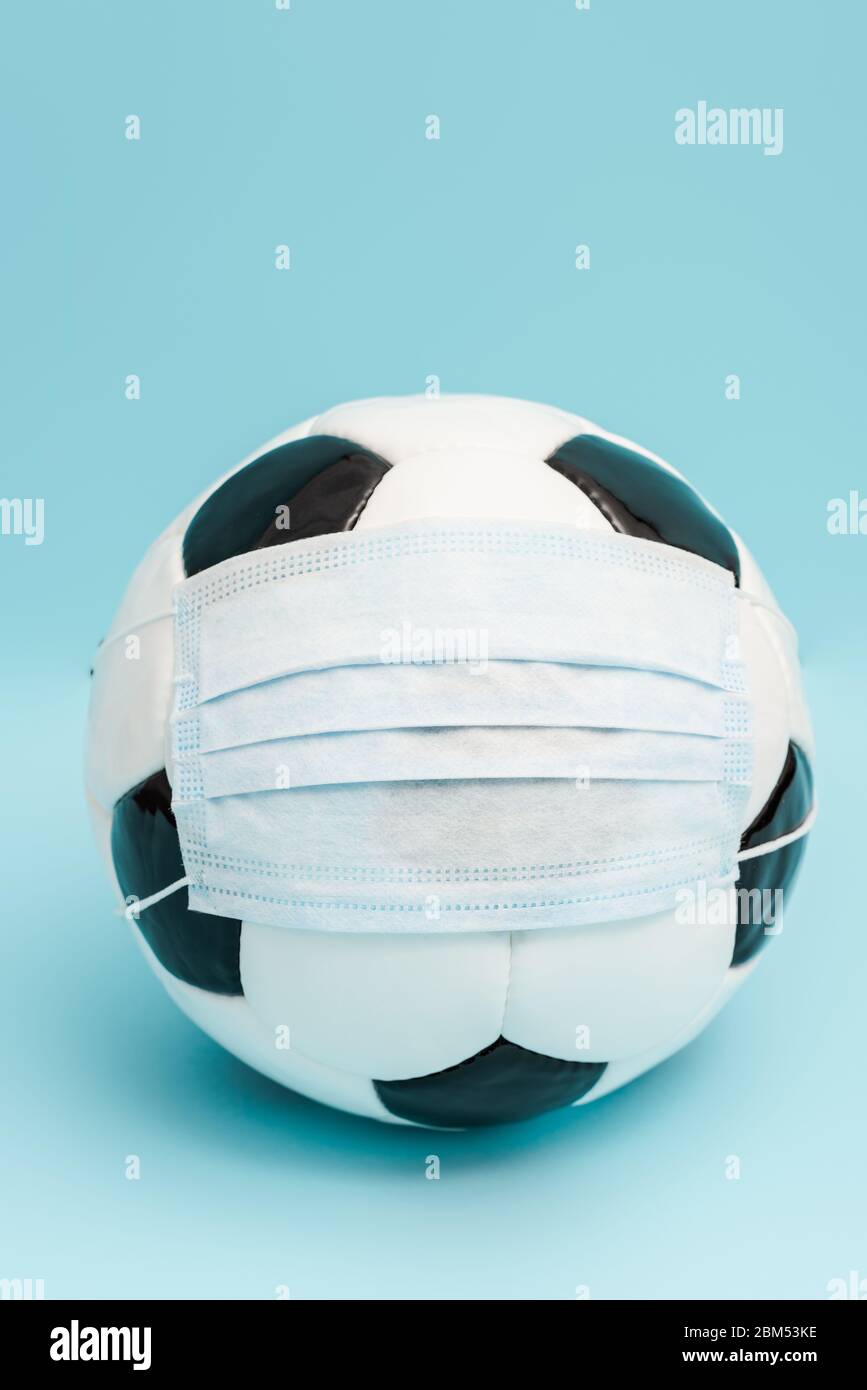 Soccer ball in medical mask hi-res stock photography and images - Alamy