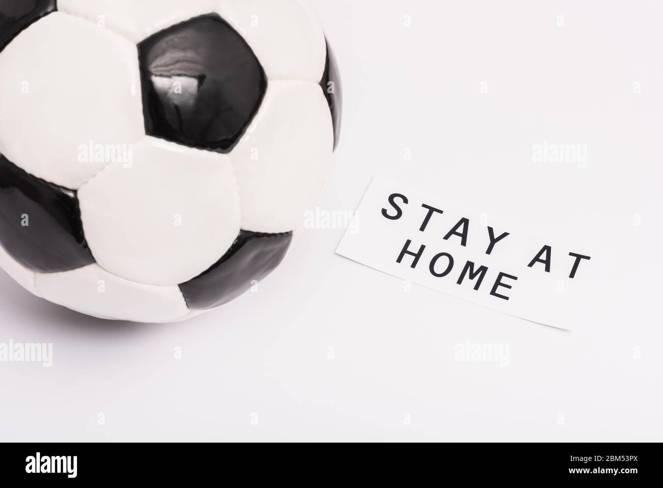 football near paper with stay at home lettering on white Stock Photo ...
