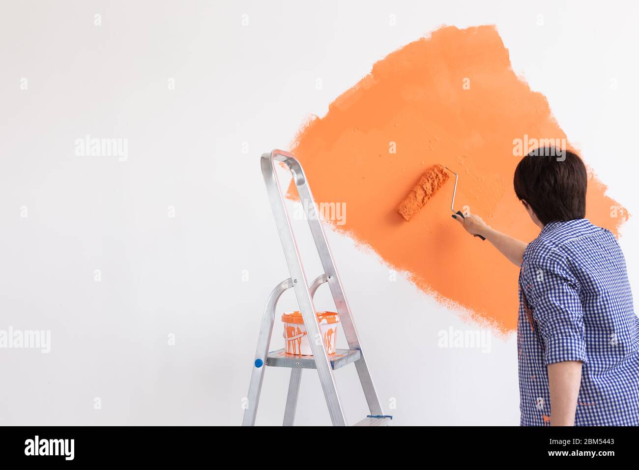 Renovation, redecoration and repair concept - middle-aged woman ...