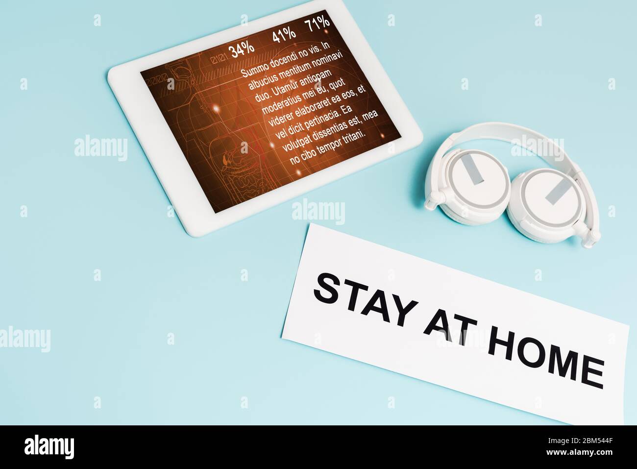 digital tablet with medical app near headphones and paper with stay at ...