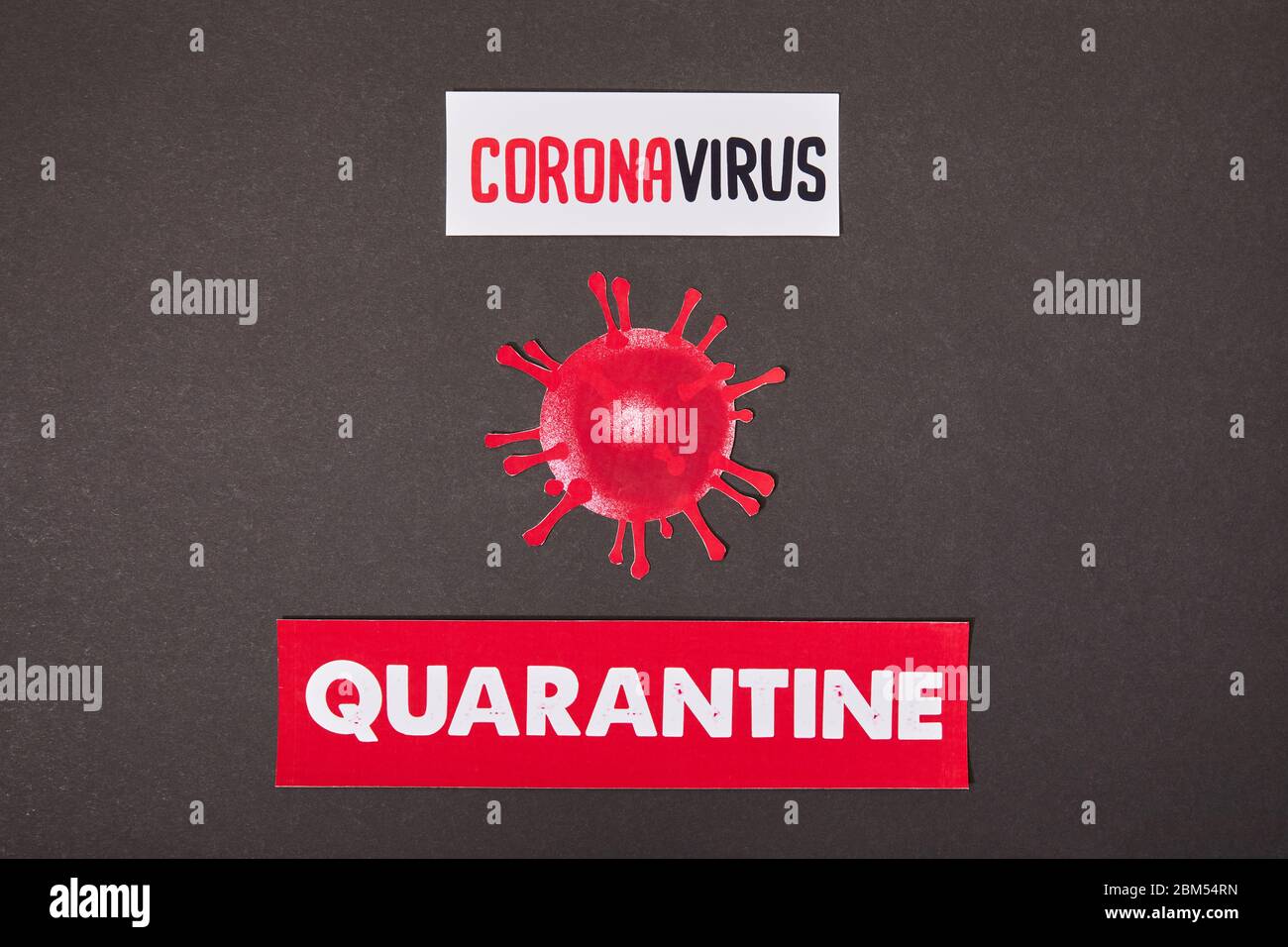 top view of papers with quarantine and coronavirus lettering near drawn ...
