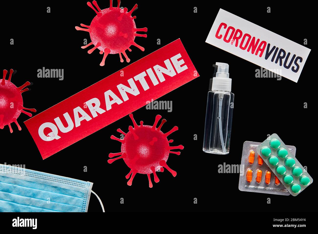 top view of papers with quarantine and coronavirus lettering near ...