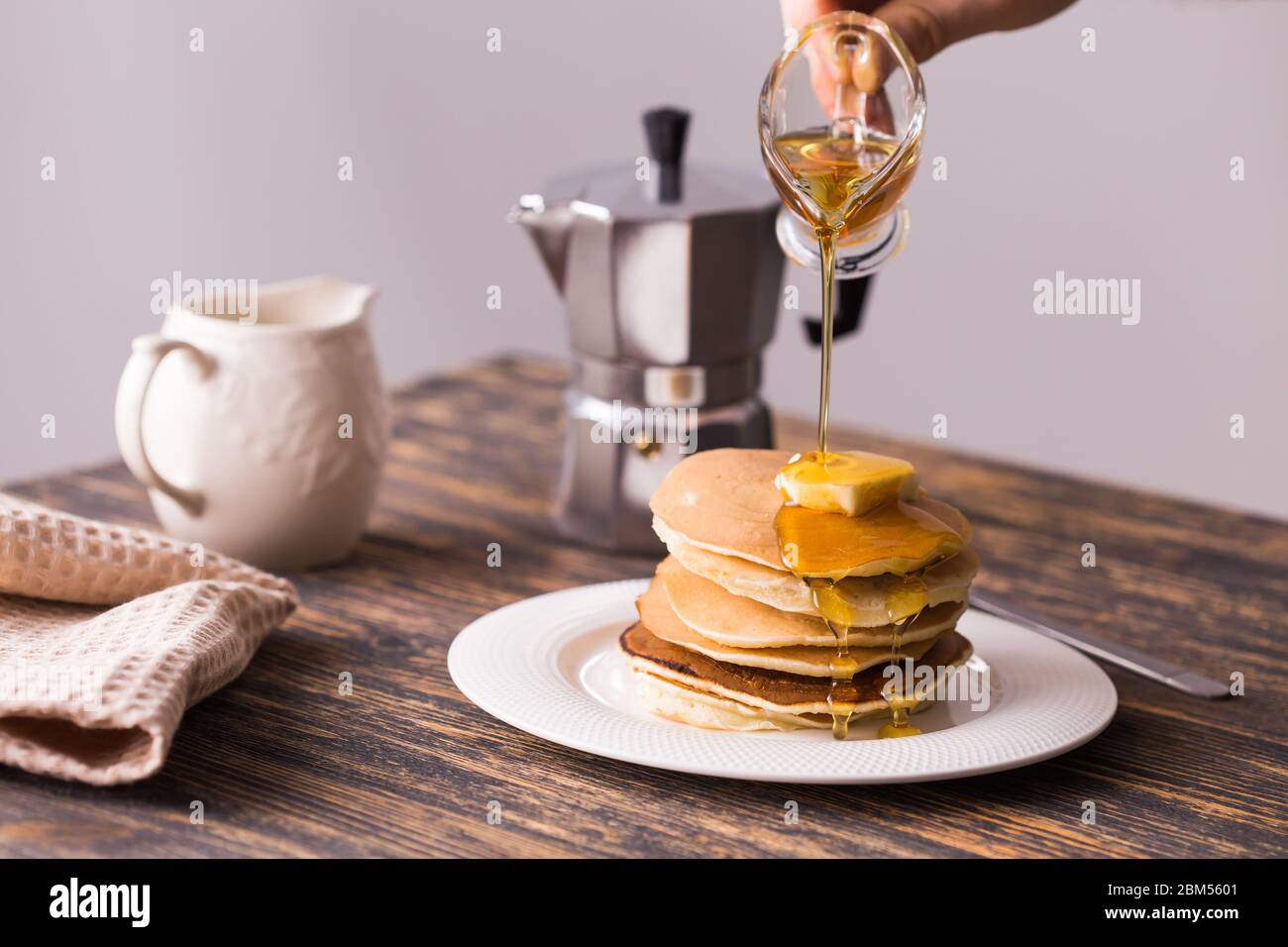 Woman pouring hot syrup hi-res stock photography and images - Alamy
