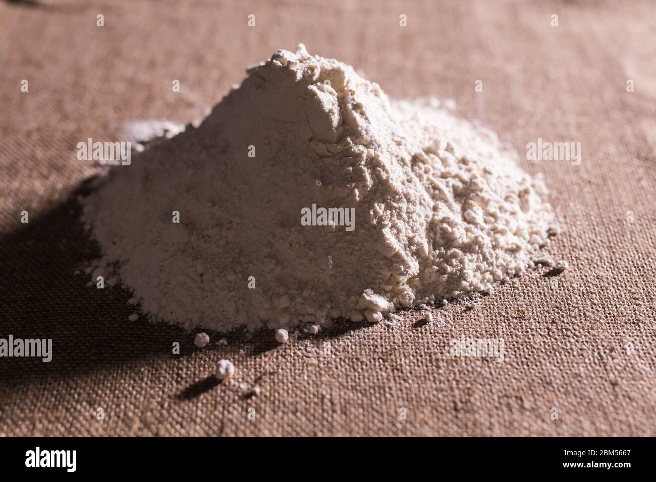 White flour on textile background texture photo Stock Photo - Alamy