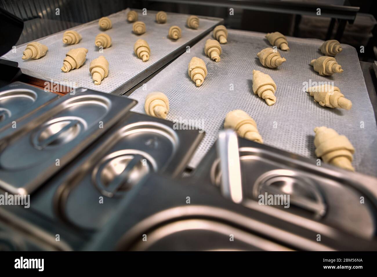 Small Business. Bakery shop production croissants on tray close-up ...