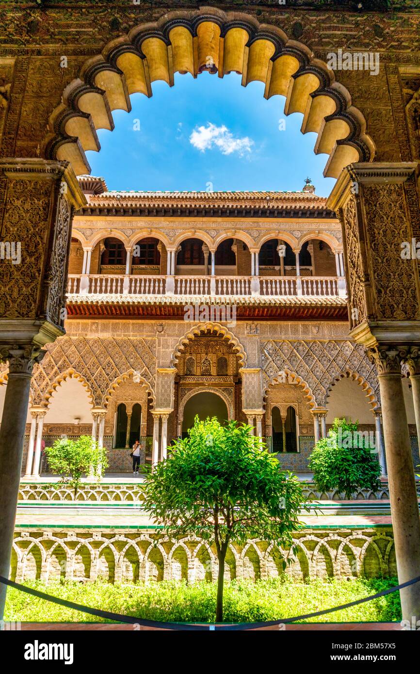 Moorish architecture of beautiful castle called Real Alcazar in Seville ...
