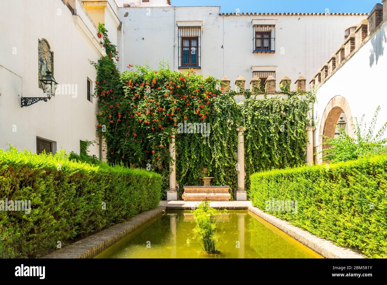 Moorish architecture of beautiful castle called Real Alcazar in Seville ...