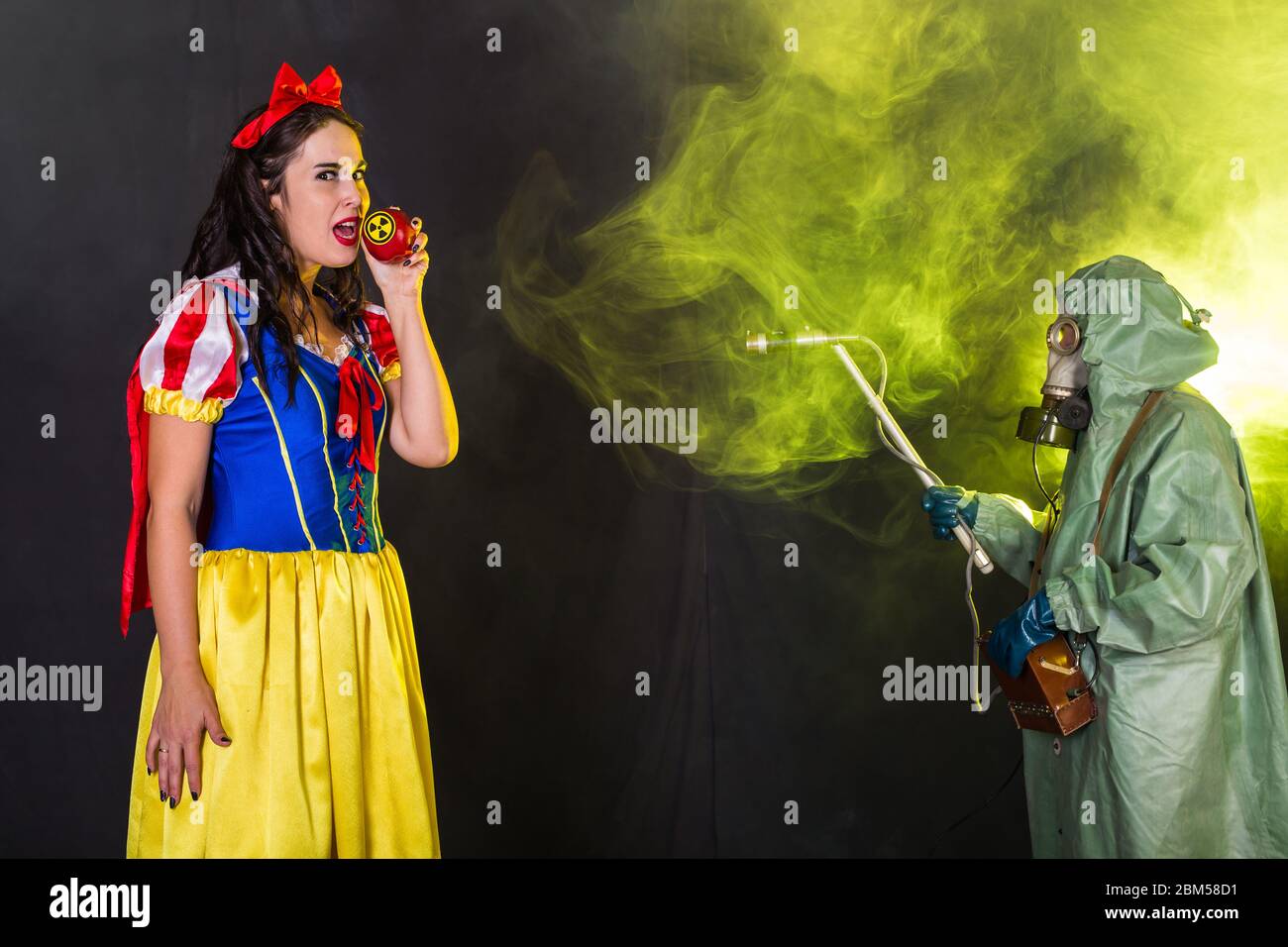 Woman holding hazardous radioactive apple. Nuclear and radiation ...